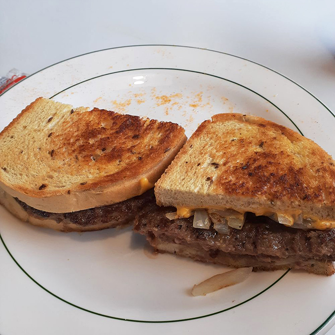 The humble patty melt – where caramelized onions, melted cheese and griddled rye bread create sandwich perfection without showing off.