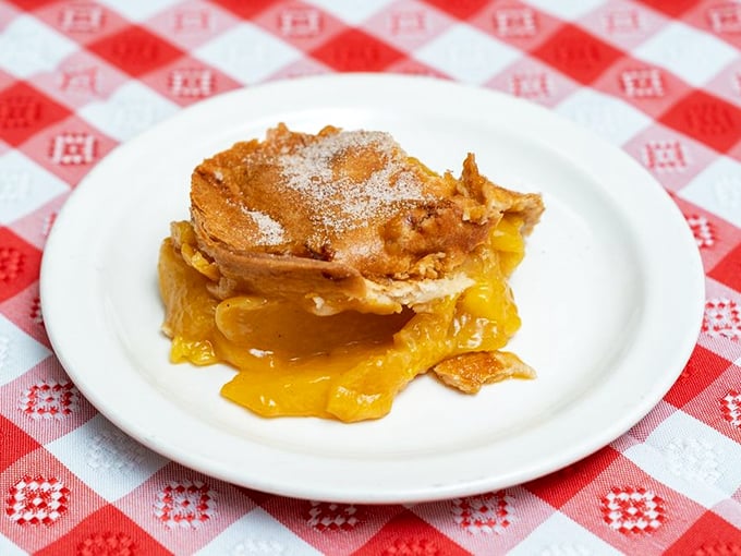 This peach cobbler isn't just dessert—it's the sweet finale to a smoky symphony, oozing with fruit and nostalgia.