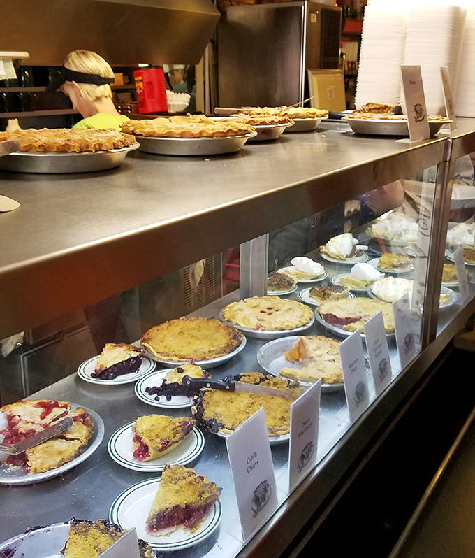 The pie case at Cooky's isn't just a display—it's a museum of edible art where each piece deserves its own velvet rope and audio tour.