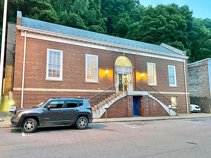 The Post Office stands as solid as the institution itself—brick, symmetry, and those warm lights saying "come on in, we've got your mail."