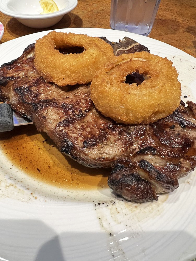 This porterhouse steak with onion rings isn't just dinner—it's a declaration that some classics never need reinvention.