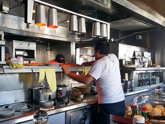 Where the magic happens – line cooks orchestrating the breakfast symphony with practiced precision and just enough organized chaos.