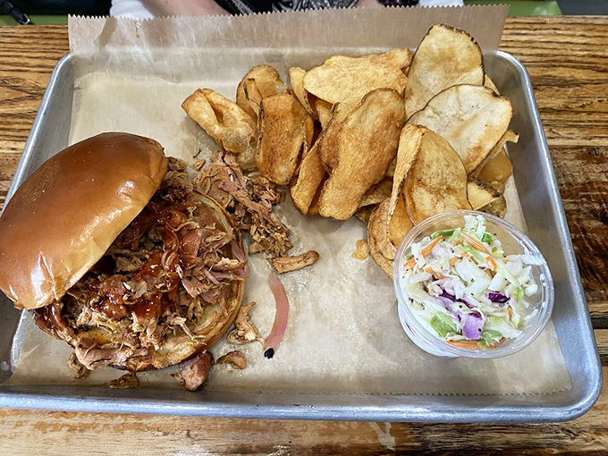 This pulled chicken sandwich platter is comfort food with a college degree—familiar yet elevated, with homemade chips that snap with satisfaction.