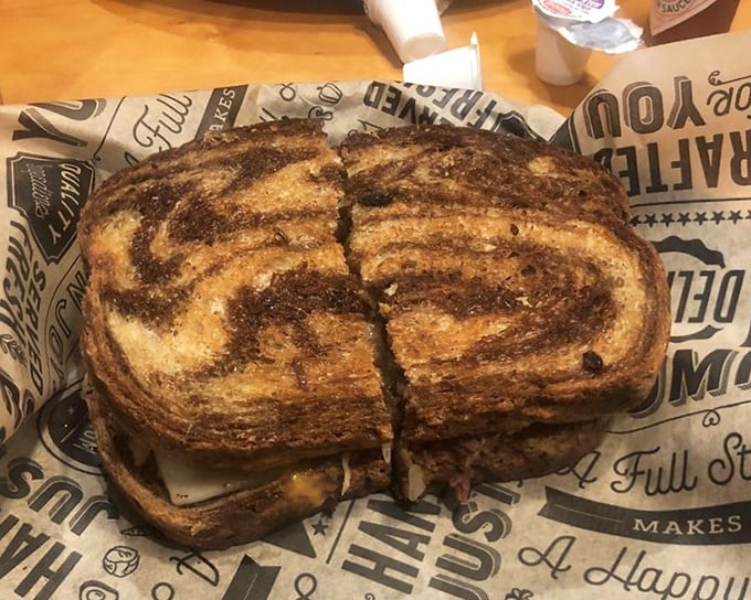 This isn't just a sandwich—it's architecture. Layers of flavor stacked with the precision of a Jenga master who also happens to understand the human soul.