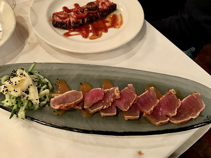 Seared tuna that's dressed better than most people at the table—rare in the middle with a perfectly tailored crust.