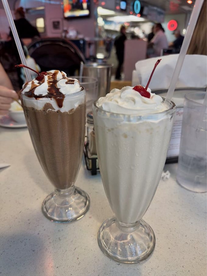 Milkshakes served in those classic fountain glasses—proof that some pleasures never go out of style, especially when topped with whipped cream and nostalgia.