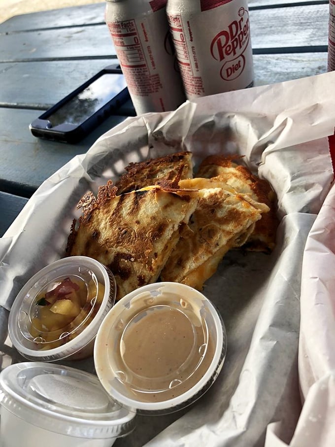 This quesadilla has achieved what diplomats cannot—perfect harmony between sea and land. The lime isn't decoration; it's essential punctuation to this cheesy narrative.
