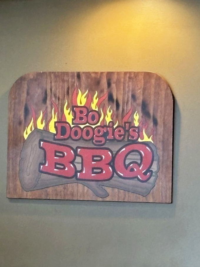 The wooden sign that launched a thousand cravings. Like a lighthouse for the hungry, those flames guide barbecue pilgrims to their smoky destination.