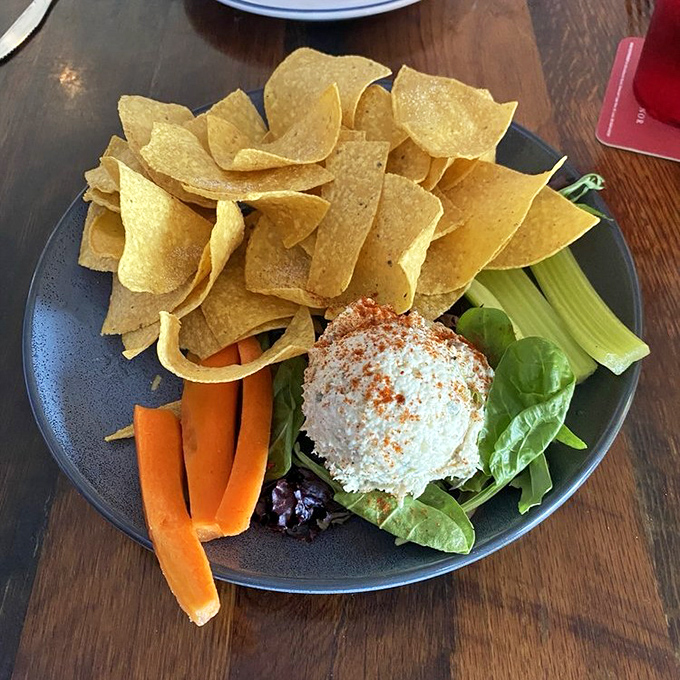 The smoked fish dip—Florida's unofficial appetizer—sits proudly surrounded by colorful veggies and crisp tortilla chips, ready for its moment.
