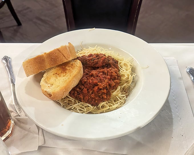 Spaghetti with meat sauce and garlic bread – not what you came for, but somehow exactly what you wanted at this temple of Midwest comfort.