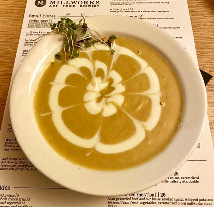 Soup as performance art—that cream swirl deserves a standing ovation. Proof that vegetables can be both virtuous and decadent.