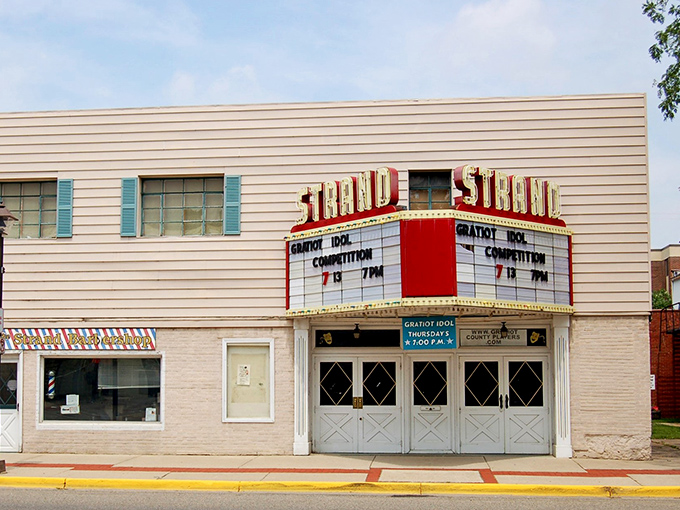 The Strand Theatre's marquee glows with small-town promise—no $20 popcorn or 30 minutes of previews here.