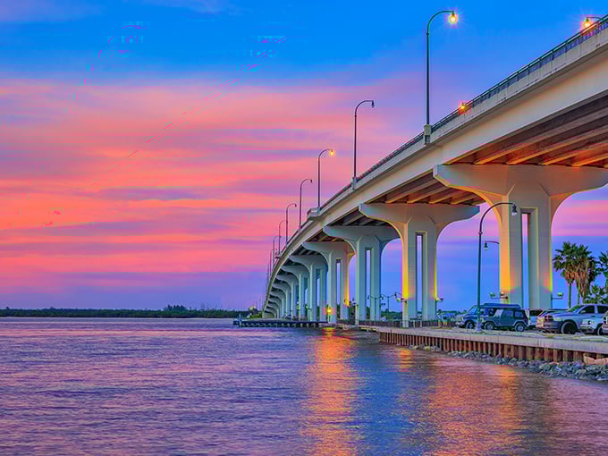 Engineering meets artistry at sunset. The Frank A. Wacha Bridge transforms from functional passage to watercolor masterpiece as day surrenders to dusk.
