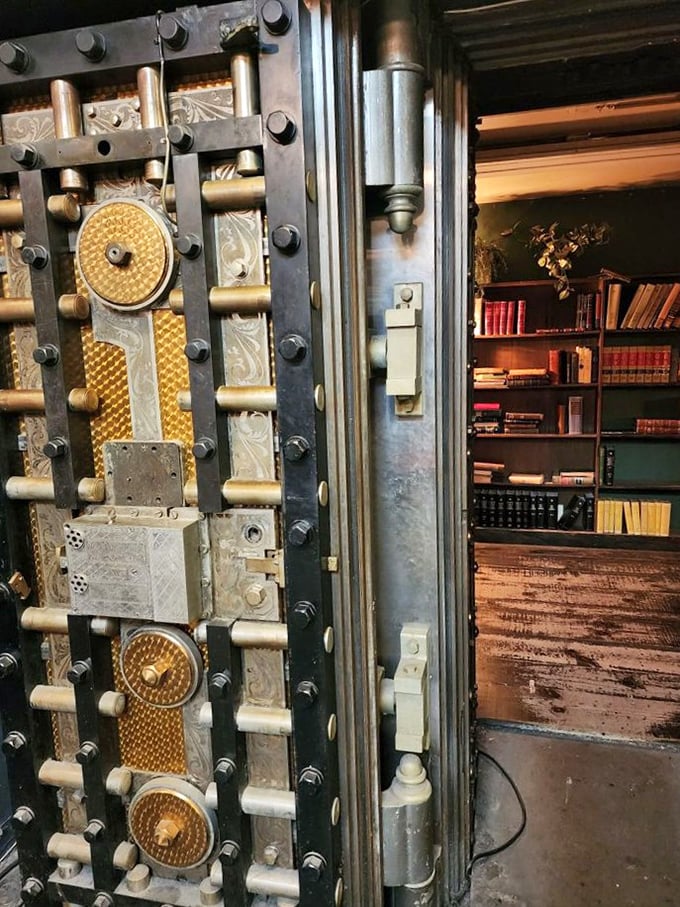 The original bank vault door stands guard over literary treasures instead of gold bars—a metaphor too perfect to ignore.