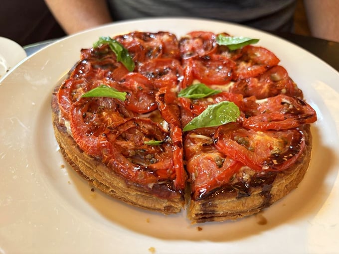 A tomato tart that proves simplicity is the ultimate sophistication – summer sunshine captured in buttery pastry.