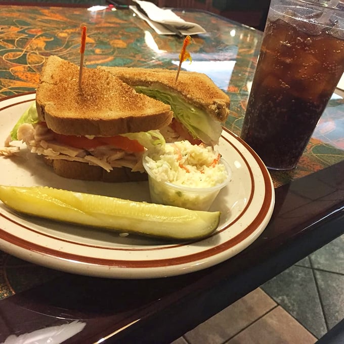 The classic club sandwich: where turkey, lettuce, and tomato meet in three-tiered harmony. A diner masterpiece that never disappoints.