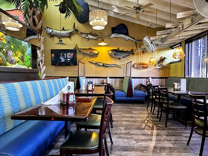 The dining room where fish go to retire – mounted trophies watching over diners like aquatic guardian angels of good taste.