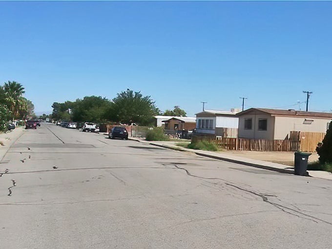 Modest homes line sun-baked streets where desert living means embracing simplicity, space, and the occasional crack in the asphalt.