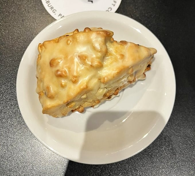 This isn't just a scone—it's edible architecture. Golden, flaky exterior gives way to a tender interior that makes supermarket pastries hang their heads in shame.
