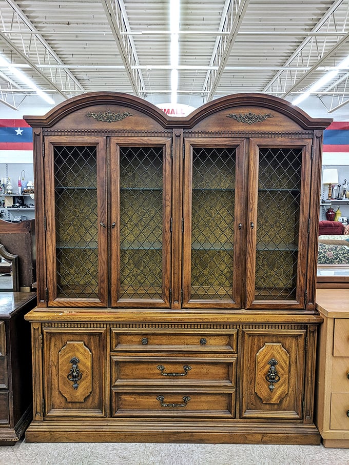 This majestic oak china cabinet isn't just furniture – it's architectural heritage waiting for its renaissance. Grandeur like this costs a fortune new.