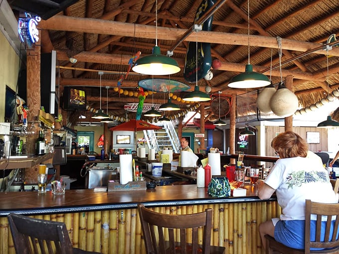 The tiki-style bar with its bamboo accents and hanging decorations isn't trying to be tropical—it simply is, like Florida itself.