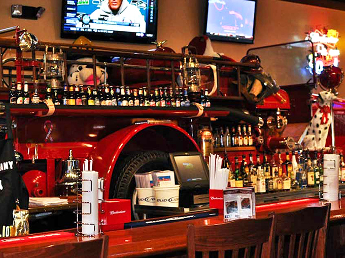 The fire truck bar isn't just decoration—it's the command center where BBQ dreams are dispatched to hungry patrons throughout the restaurant.