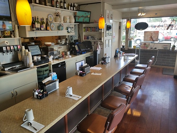 The counter seats—where solo diners become regulars, where coffee cups are never empty, and where the best diner stories are exchanged.