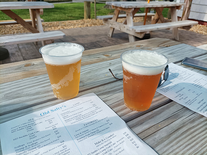 Cold beer and menus on weathered wooden tables—the perfect prelude to seafood feasting. Some decisions are worth taking your time with.
