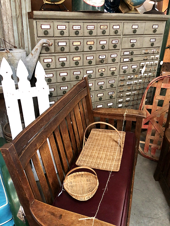 A vintage bench sits before an old card catalog – two relics from when "browsing" meant physically moving through a space.