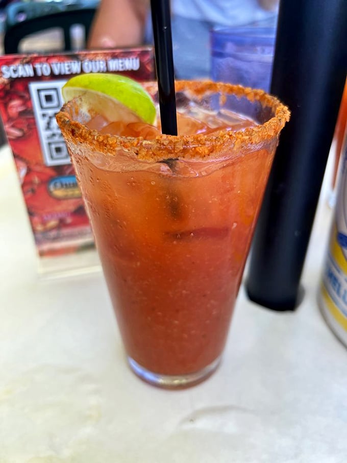 A Bloody Mary with a spice-crusted rim and lime garnish—the ideal maritime companion whether you're celebrating or recovering.