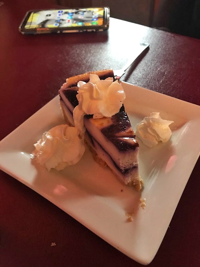 This slice of blueberry cheesecake doesn't just end the meal—it provides closure, like the perfect final chapter of a delicious story.