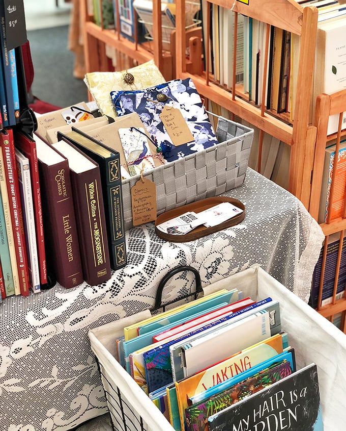 Books stacked with stories waiting to transport readers far beyond this Pennsylvania parking lot adventure.