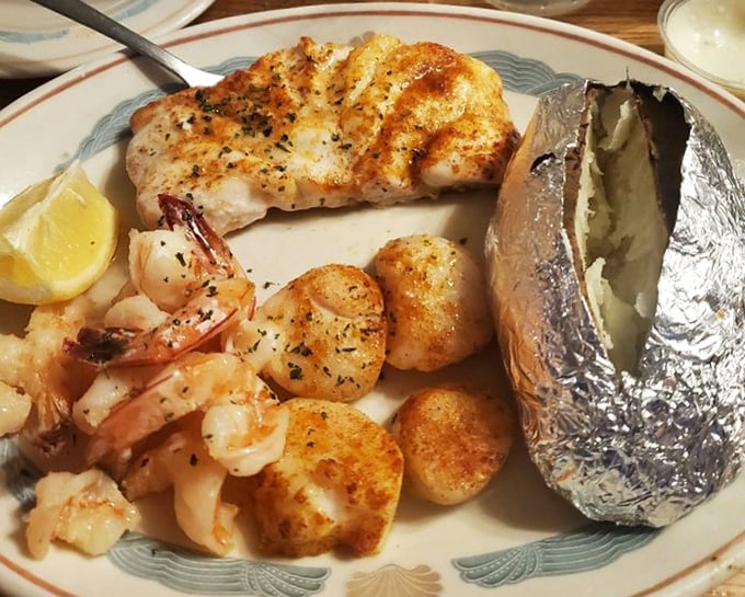 This isn't just a seafood platter – it's an edible work of art featuring perfectly broiled fish, plump shrimp, and scallops worth fighting over.