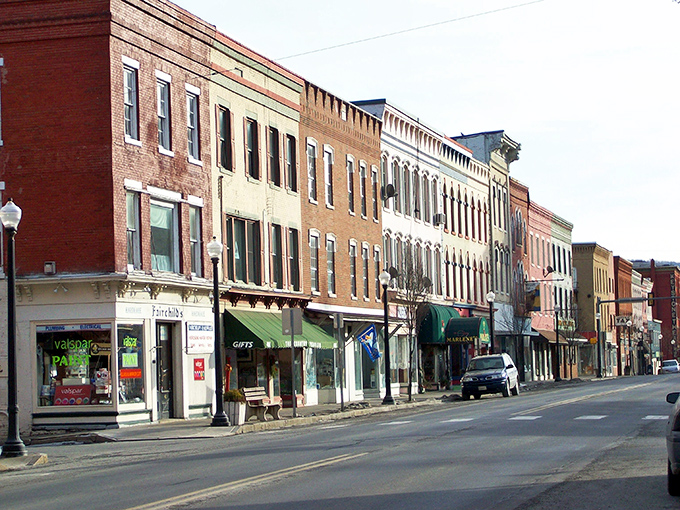 A rainbow of historic storefronts creates Towanda's architectural harmony—each building playing its own colorful note in this small-town symphony.