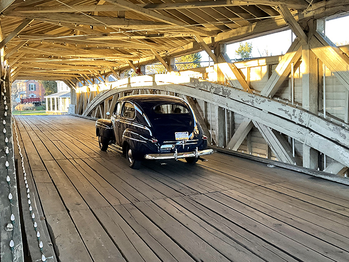 Classic cars crossing historic bridges create moments when past and present shake hands like old friends.