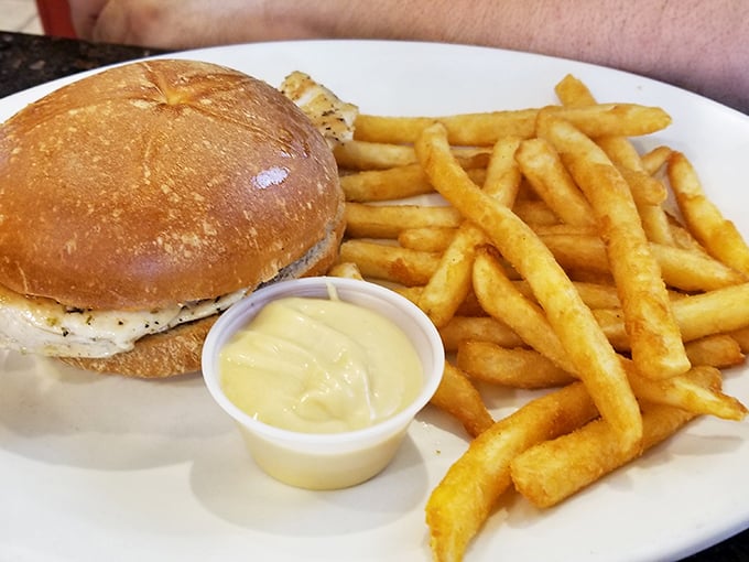 A sandwich and fries that could cure whatever ails you. That golden bun looks like it's been kissed by the toaster gods.