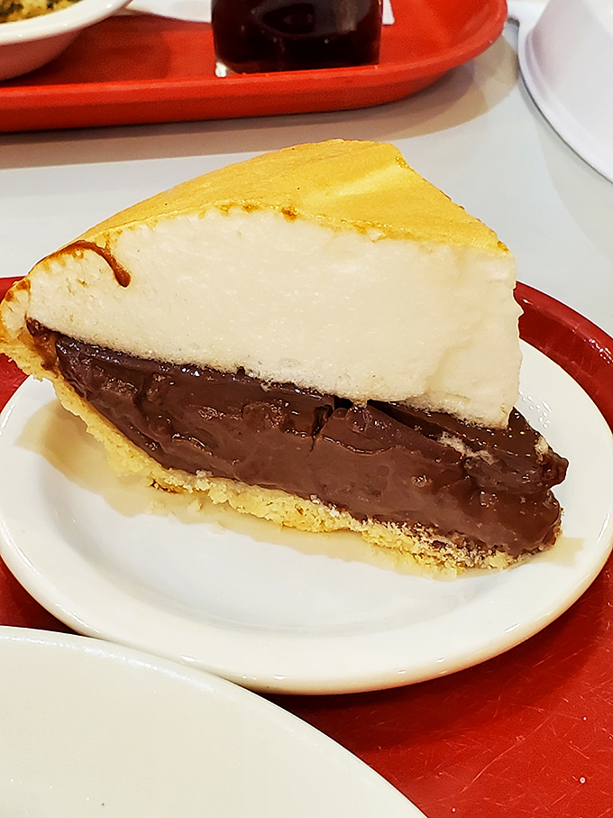 Layer upon layer of chocolate and cream reaching toward the heavens—this pie doesn't just satisfy cravings, it creates memories.