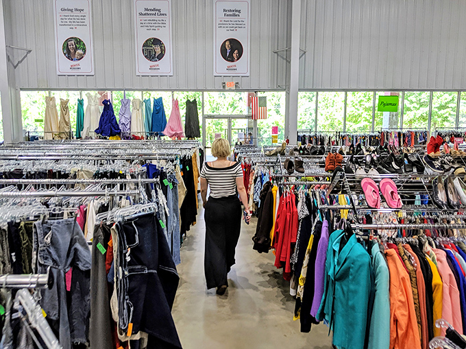 The clothing section stretches endlessly, a textile canyon where shoppers navigate rivers of fashion from every era imaginable.