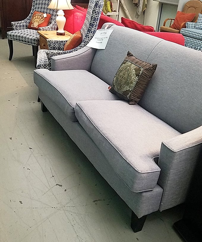 That sleek gray sofa could easily be mistaken for brand new – someone's decorating upgrade becomes your living room transformation at a fraction of retail.