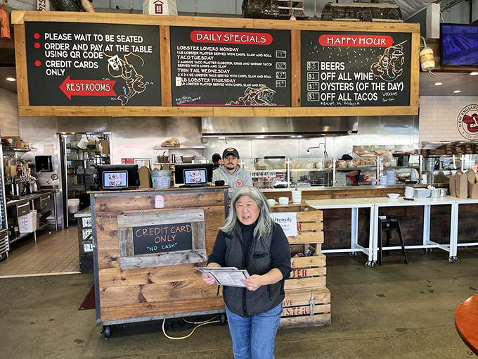The counter where dreams are ordered, paid for, and served on metal trays. Notice the lighthouse – it's guiding you to flavor salvation.