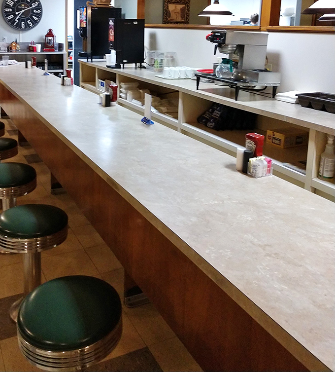 The counter seating – where solo diners become regulars and the coffee is always flowing. Diner diplomacy happens at counters like this.