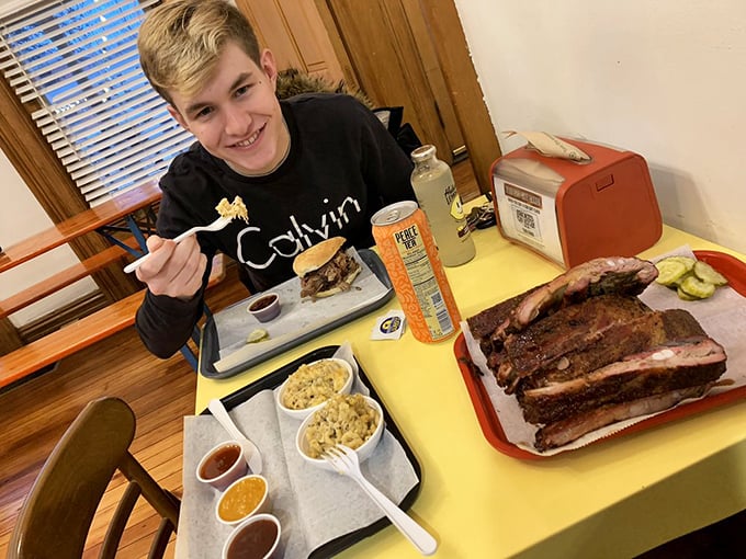 Pure barbecue bliss captured in one satisfied smile – this is what food happiness looks like in action.