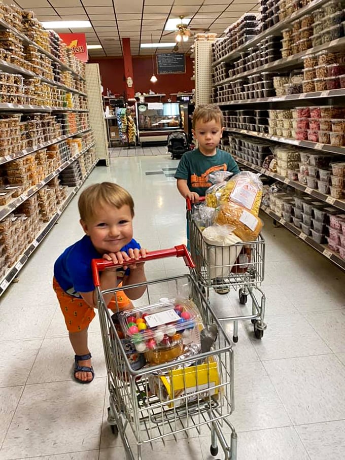 The next generation of comfort food connoisseurs, navigating aisles of temptation with the focus of seasoned professionals. Start 'em young!