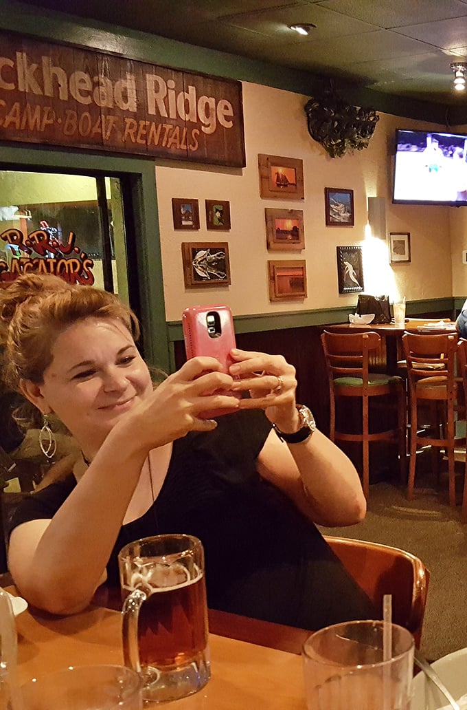 Where memories are made between sips of cold beer and bites of Florida fare. The wall décor silently judges your food choices.