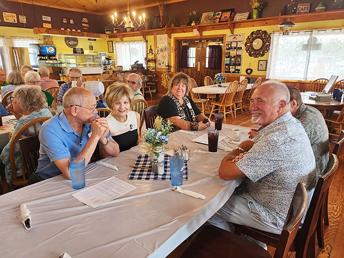 Happy diners sharing stories and coffee – the universal language of "this food was worth getting out of bed for" spoken around the table.
