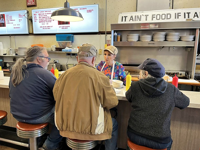 The counter crew—where regulars become family and newcomers are just regulars who haven't settled in yet.