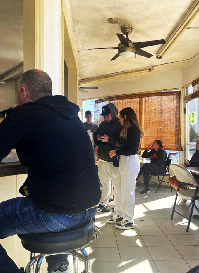 The weekend morning crowd at Corner Cottage—a democratic mix of Burbank locals united by the universal language of breakfast burrito appreciation.