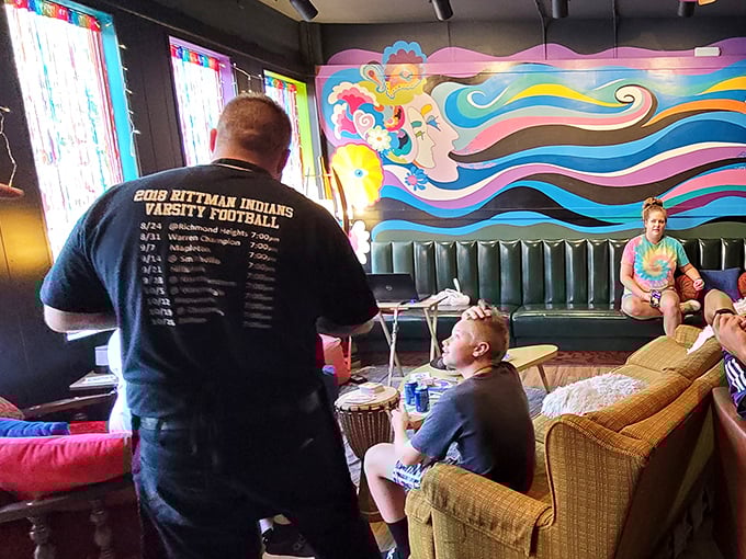 Locals gather in this technicolor dreamscape to share good food and conversation – proving great pizza brings people together across generations.