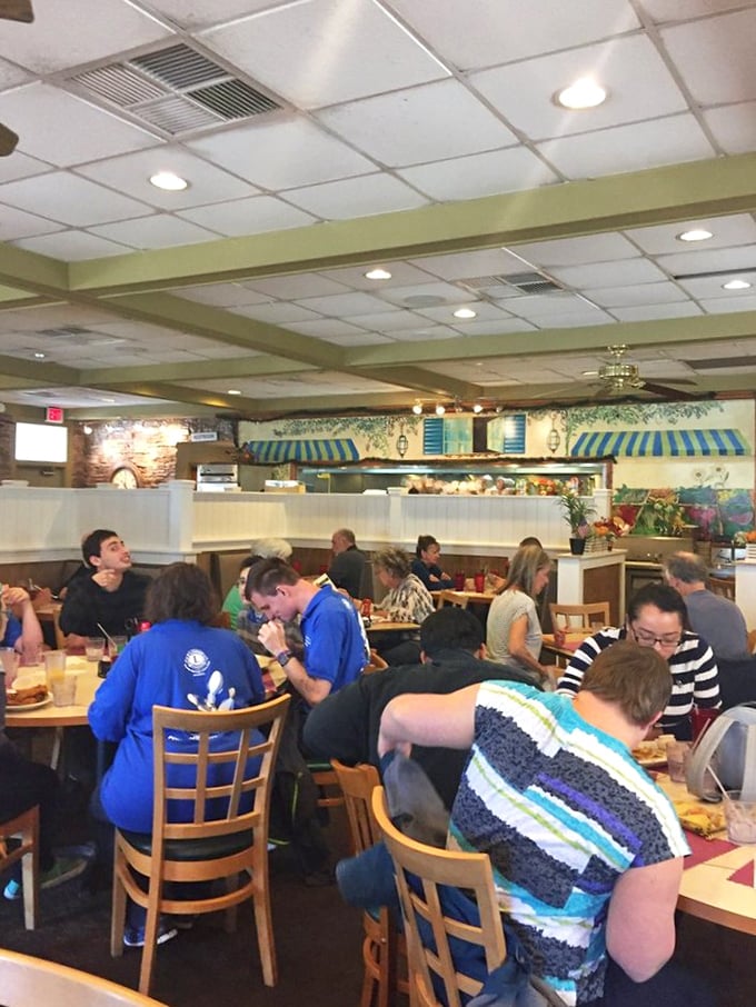The packed house tells you everything you need to know—locals don't line up unless something special awaits at the end of the wait.