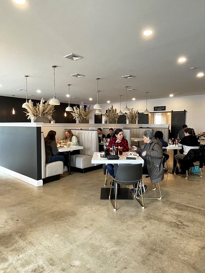 A bustling dining room where conversations flow as freely as the coffee. Notice how nobody's looking at their phones? That's the power of good food.